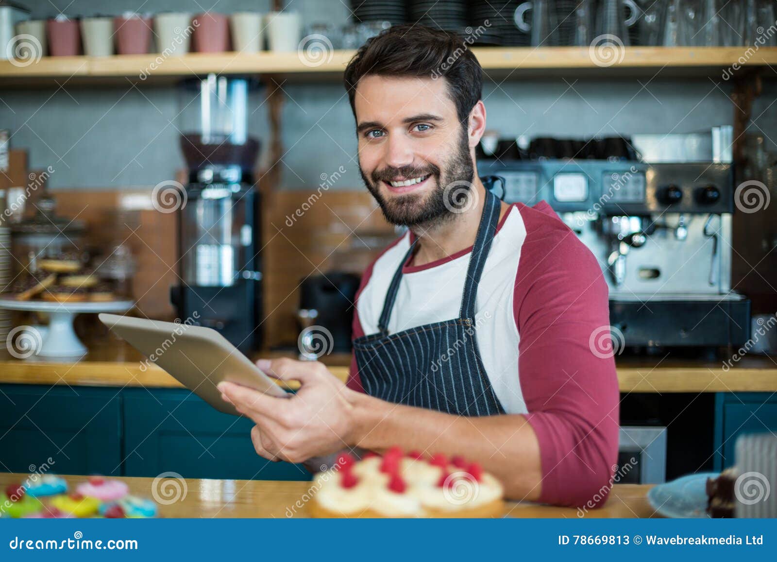 Smiling Waiter Using Digital Tablet at Counter in Cafe Stock Image ...