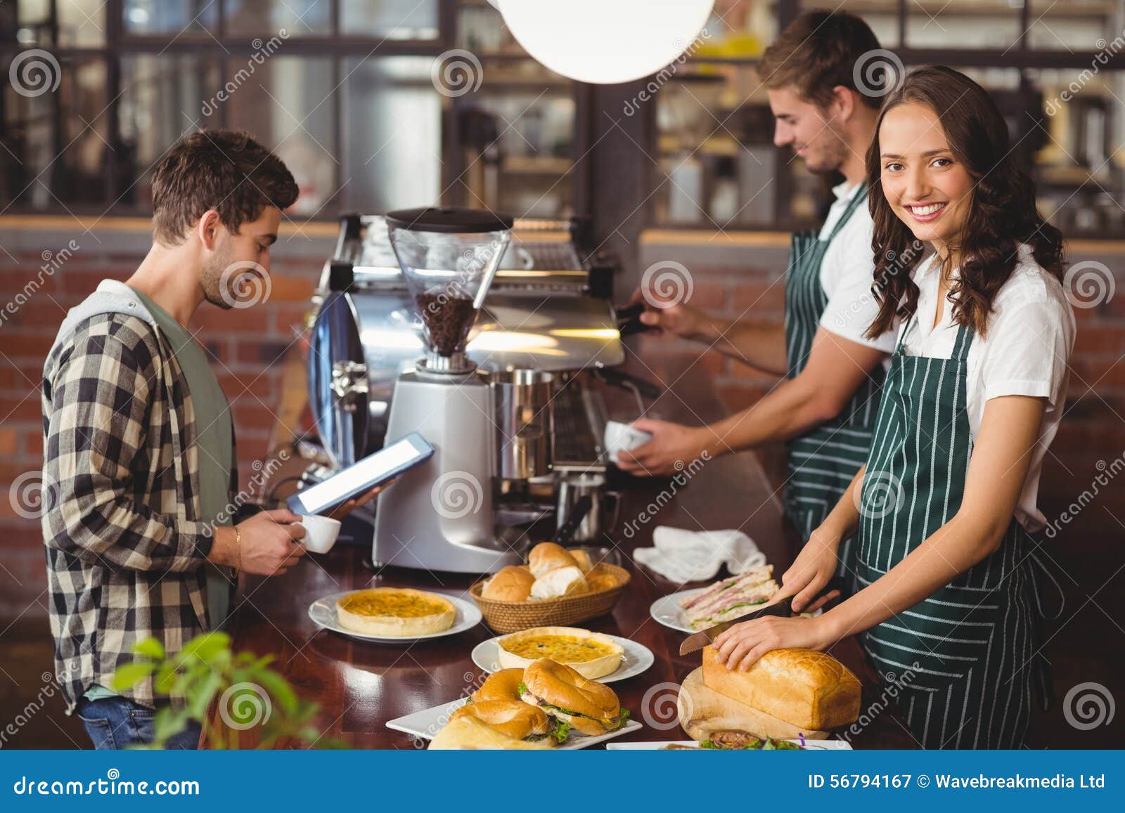 Smiling Waiters Serving a Client Stock Image - Image of people, happy ...