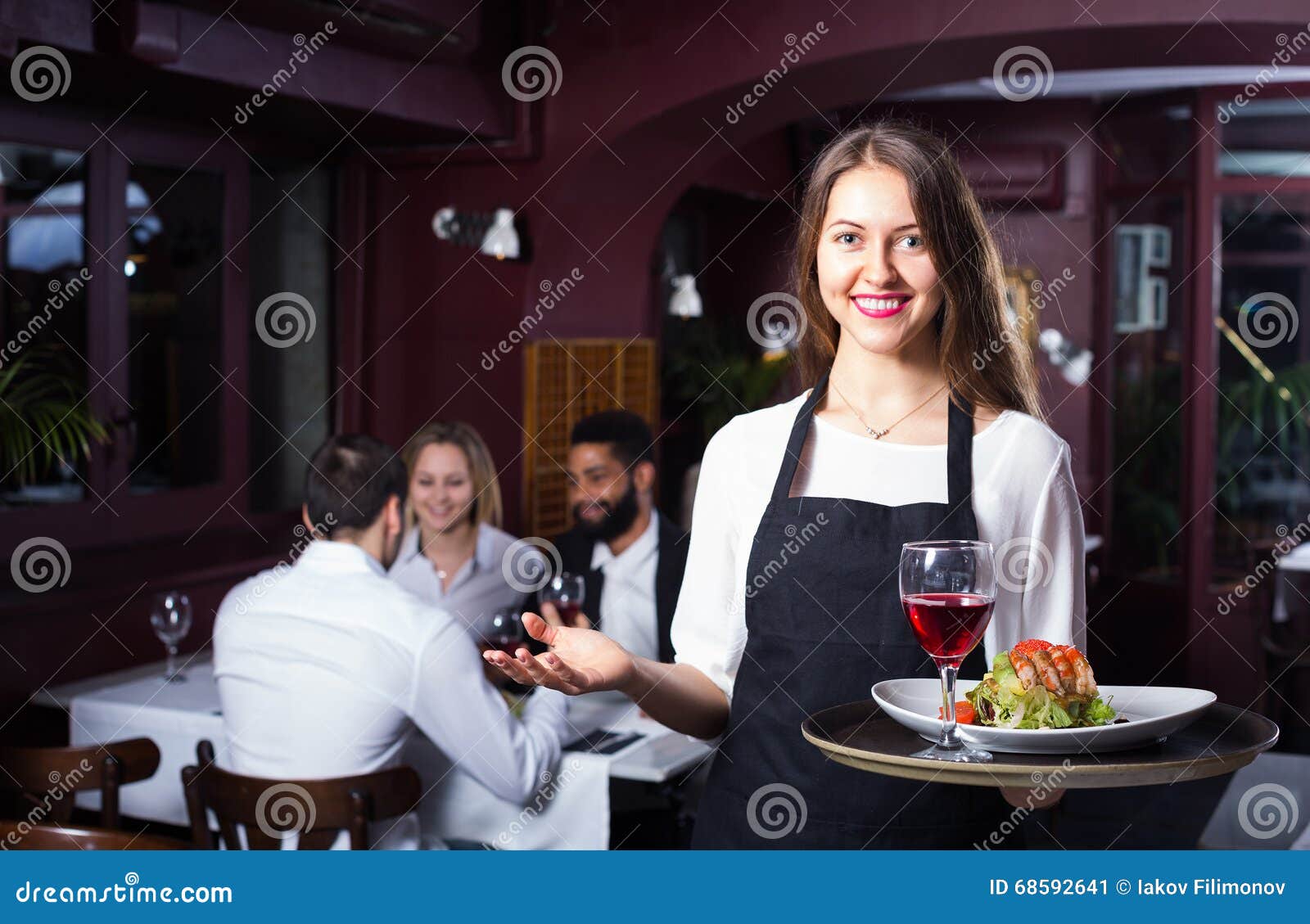 Smiling Waitress and Guests at the Table Stock Image - Image of casual ...