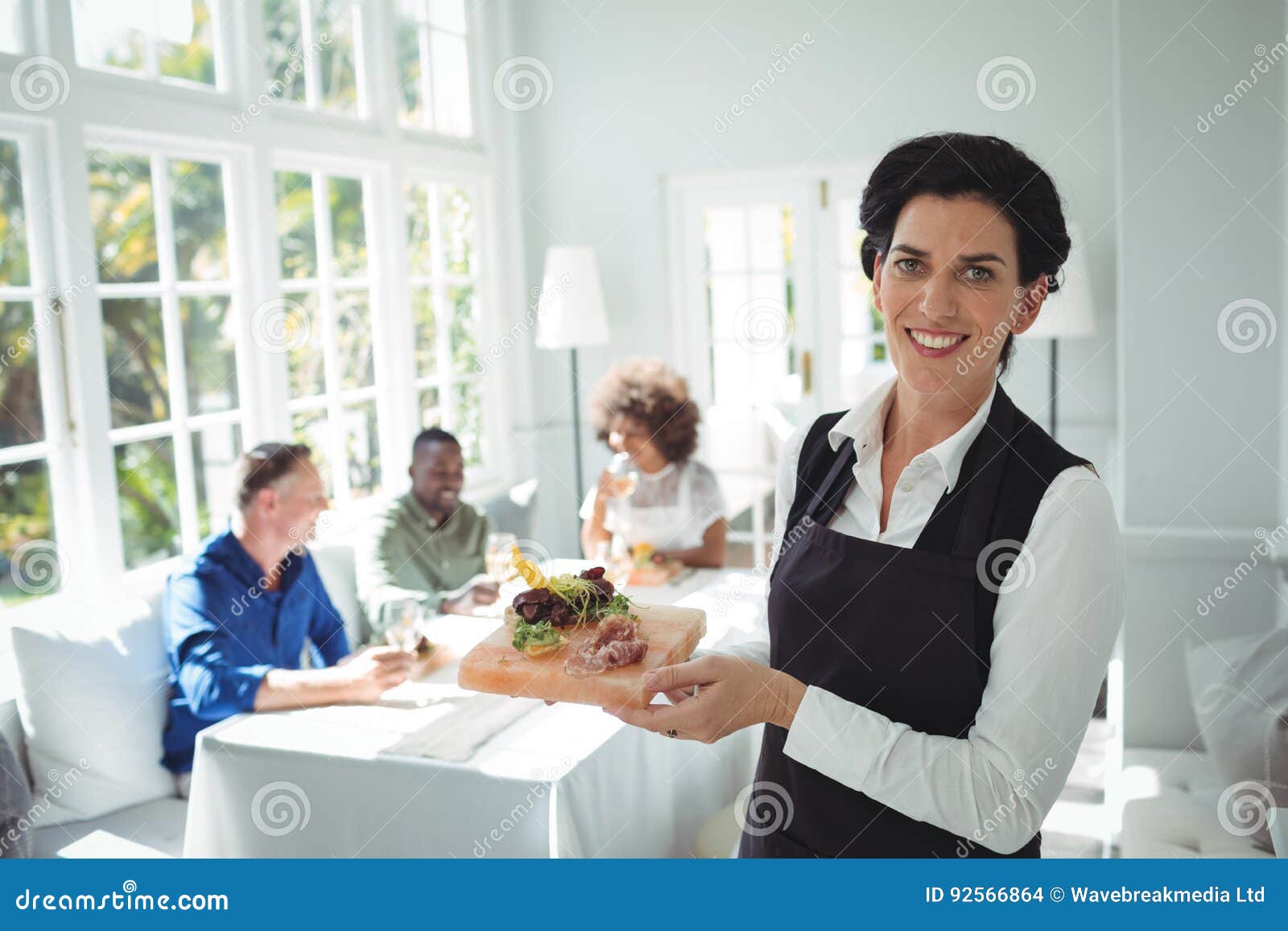 Smiling Waitress Holding Meal Tray Stock Photo - Image of dining ...