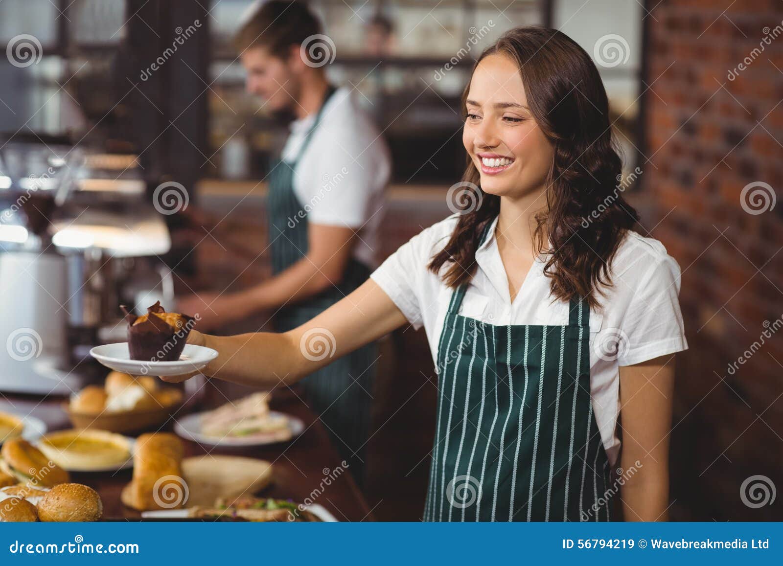 Smiling Waitress Serving a Muffin Stock Image - Image of industry ...