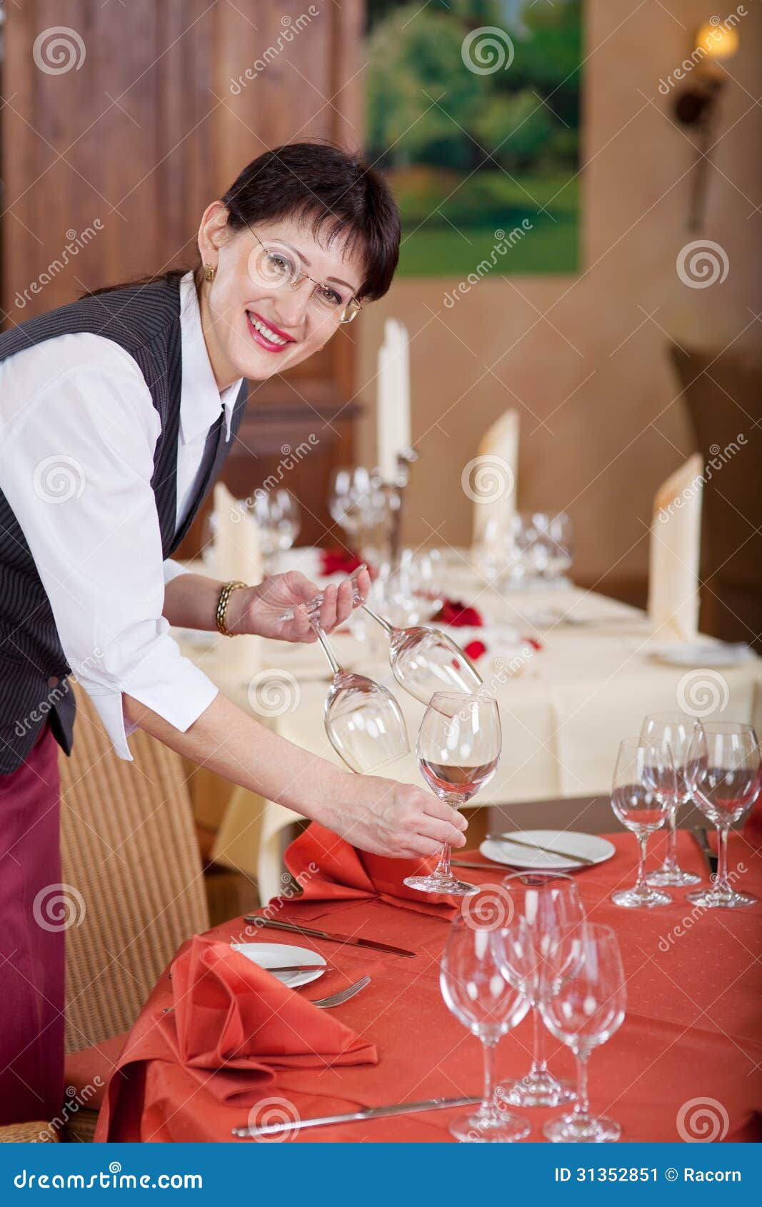 Smiling Waitress Setting the Table Stock Image - Image of midsection ...