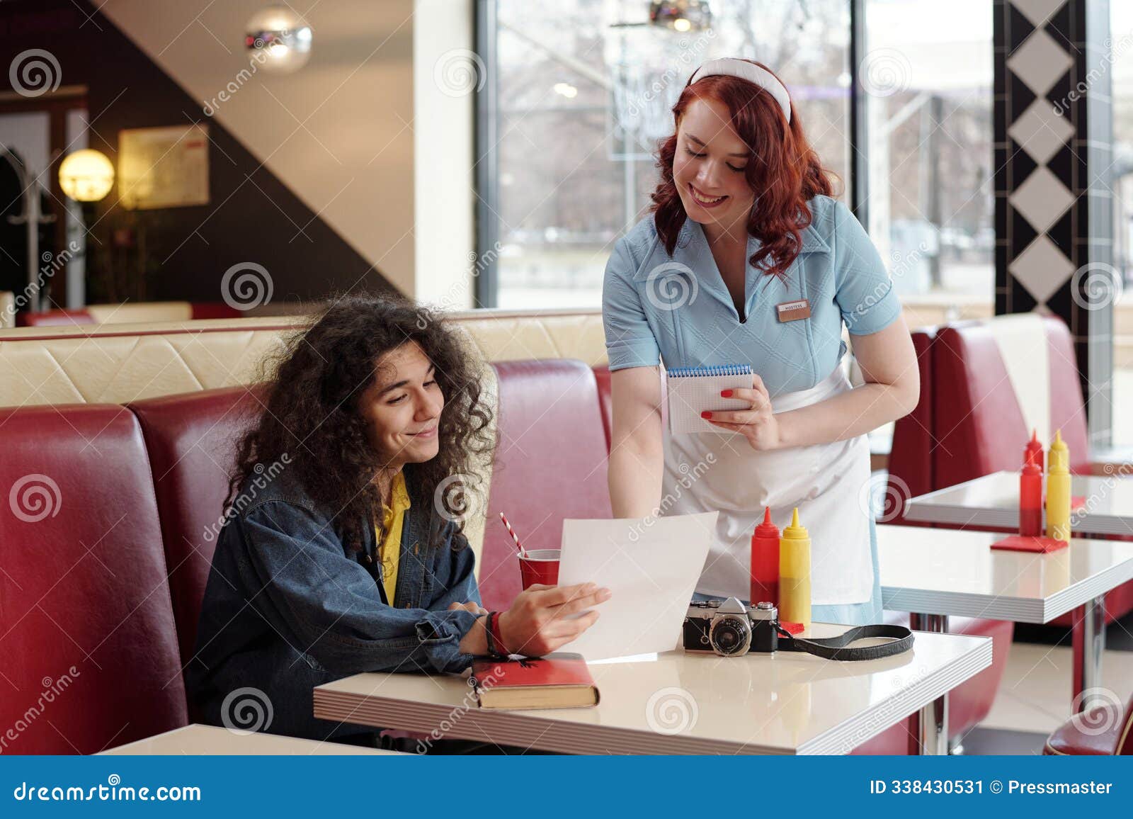 Smiling Waitress Taking Order from Customer in Diner Stock Image ...