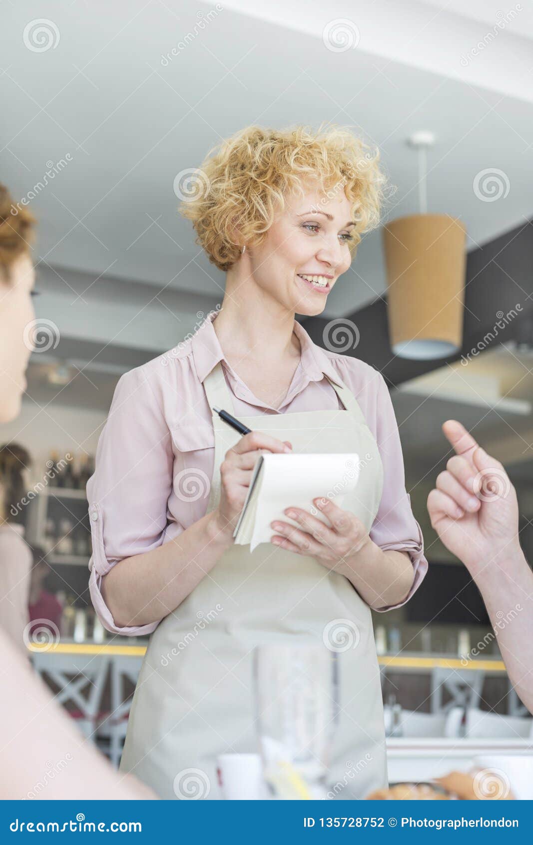 Smiling Waitress Taking Order from Man Sitting at Restaurant Stock ... Smiling Waitress Taking Order from Man Sitting at Restaurant Stock ...