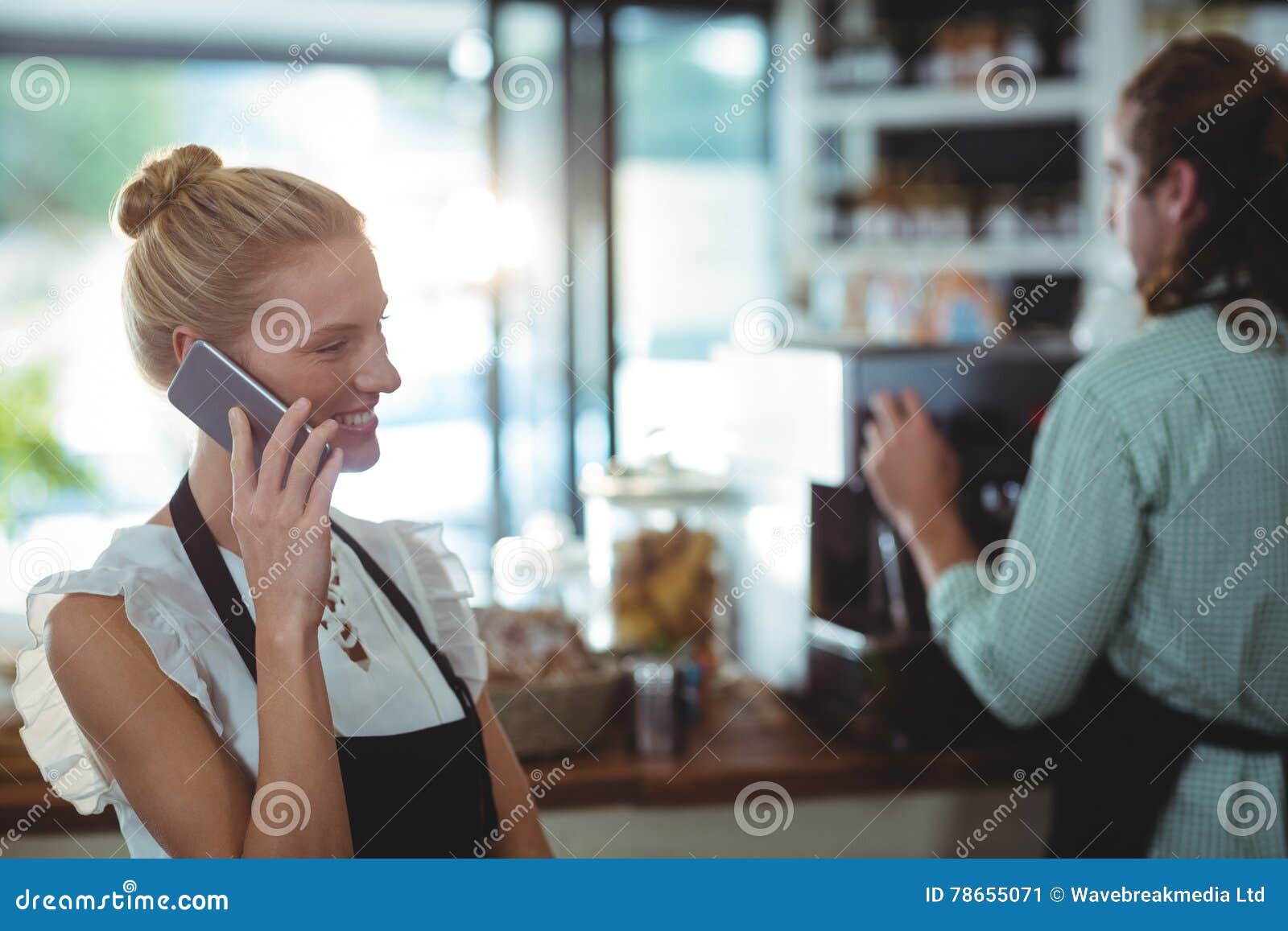 Smiling Waitress Talking on Mobile Phone Stock Image - Image of indoors ...