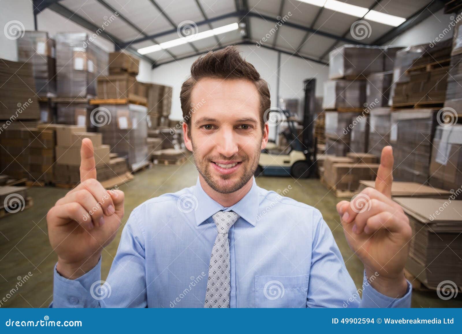 Smiling Warehouse Manager Pointing Up with Finger Stock Photo - Image ...