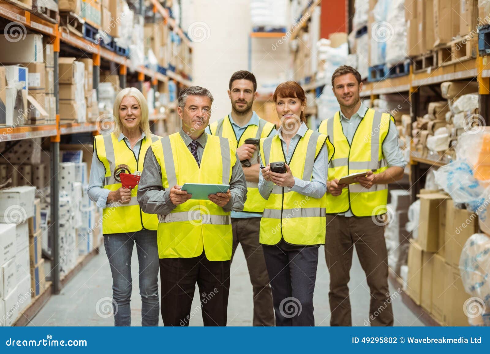 Smiling Warehouse Team Looking at Camera Stock Photo - Image of ...