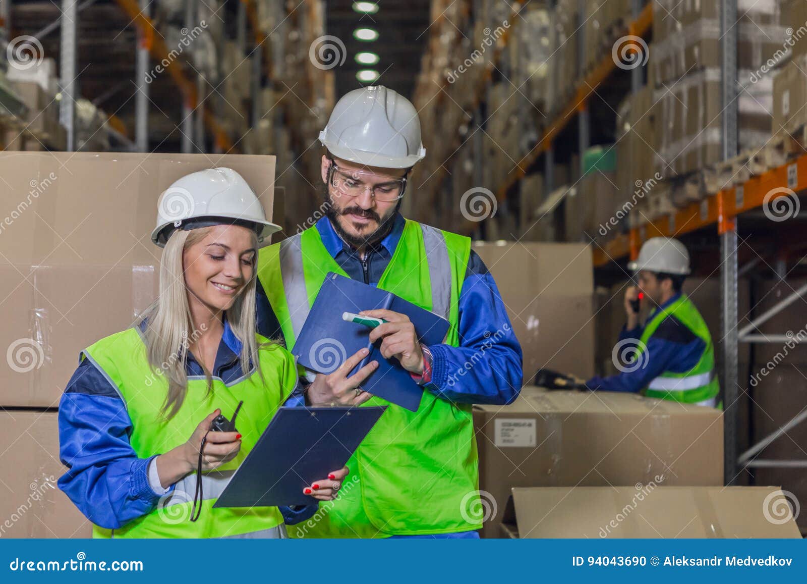 Smiling warehouse workers stock photo. Image of looking - 94043690