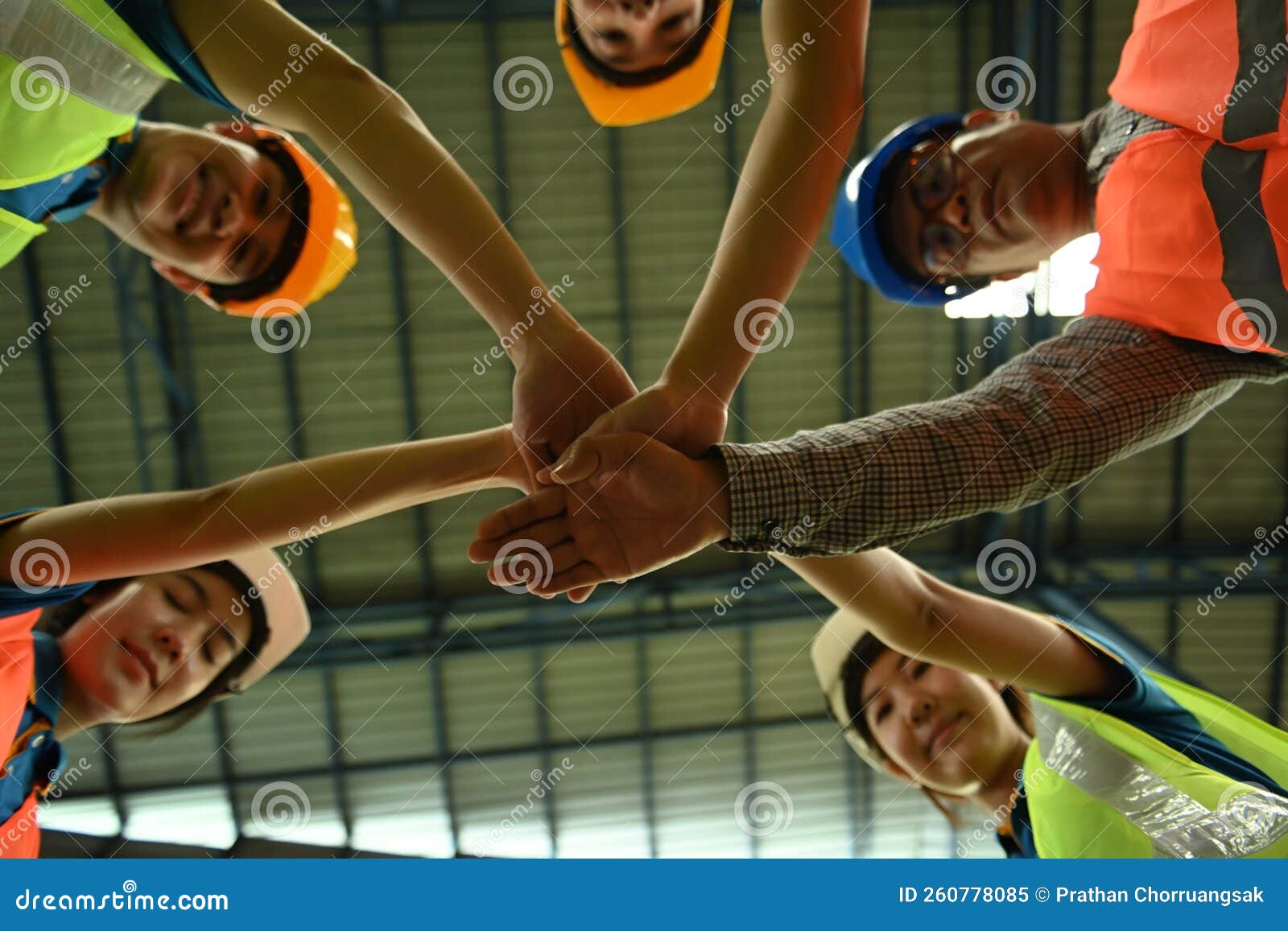 Smiling Warehouse Workers Team Stacking Hands Together Bottom View ...