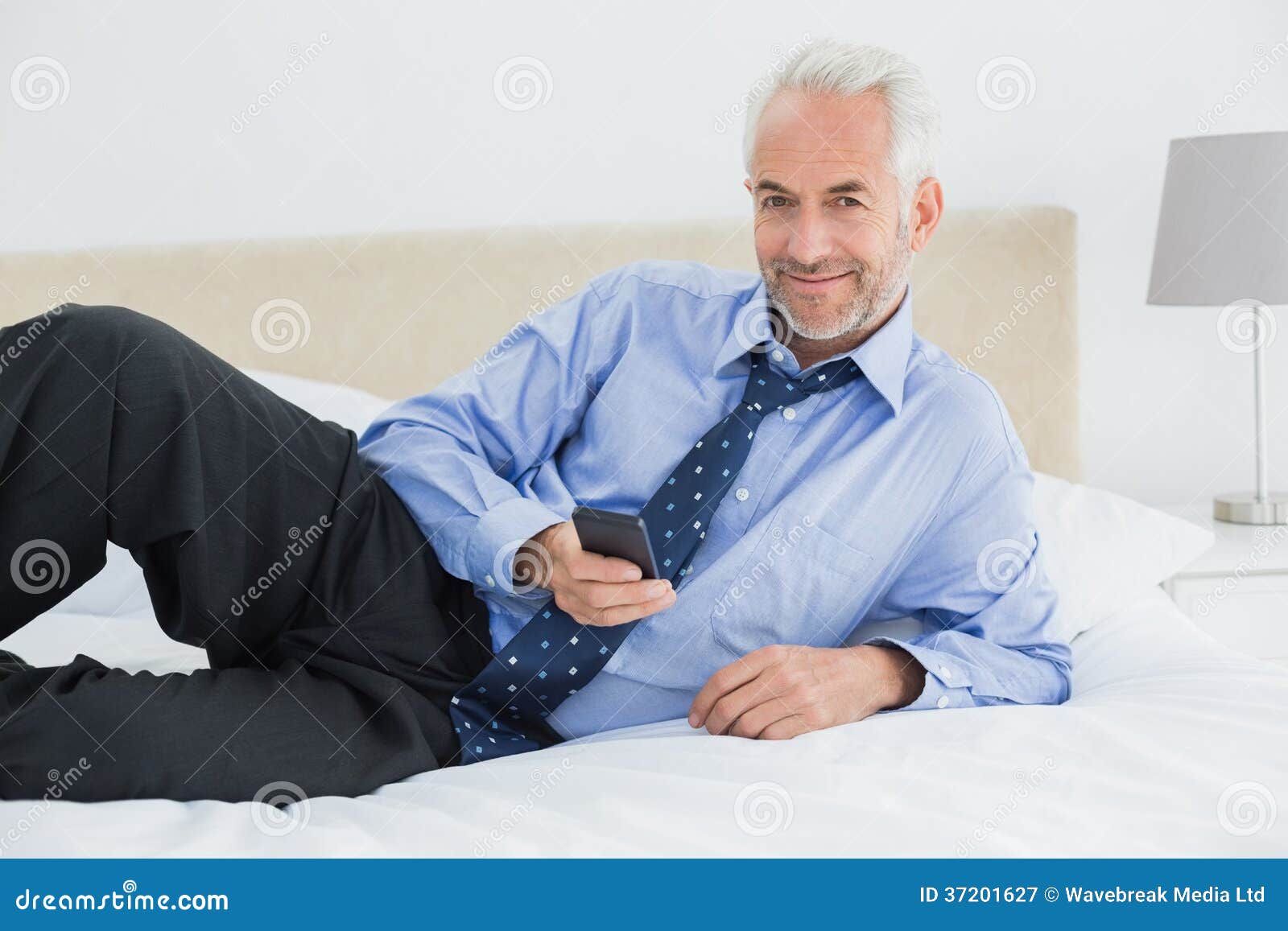 Smiling Well Dressed Man Text Messaging in Bed Stock Image - Image of ... Smiling Well Dressed Man Text Messaging in Bed Stock Image - Image of ...
