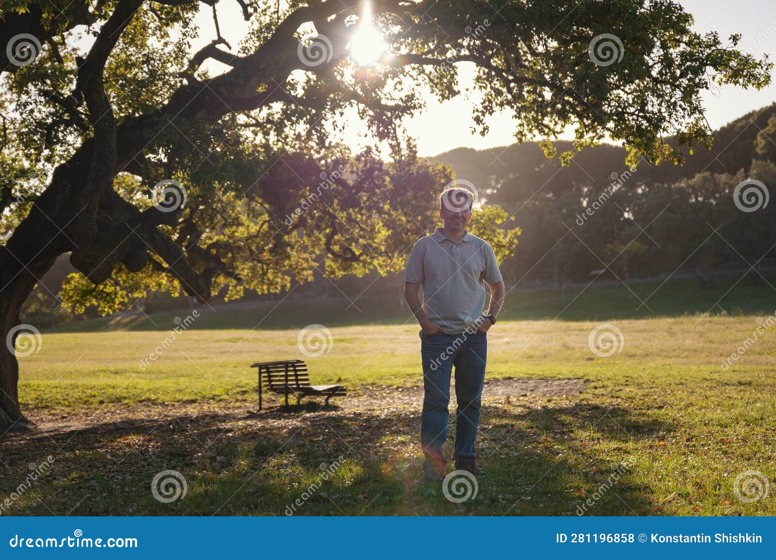 Smiling White Man Standing Under Big Tree Stock Photo - Image of ...