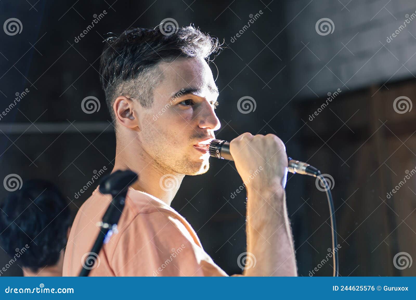 Smiling and Witty Stand Up Actor Comedian on Stage, Talking and Singing ...