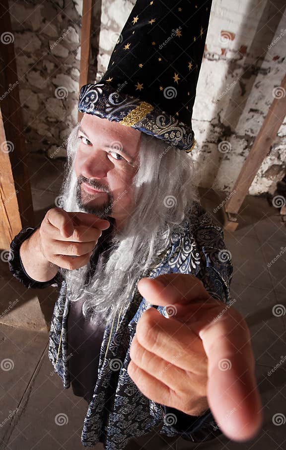Smiling Wizard Pointing stock photo. Image of grinning - 28555856
