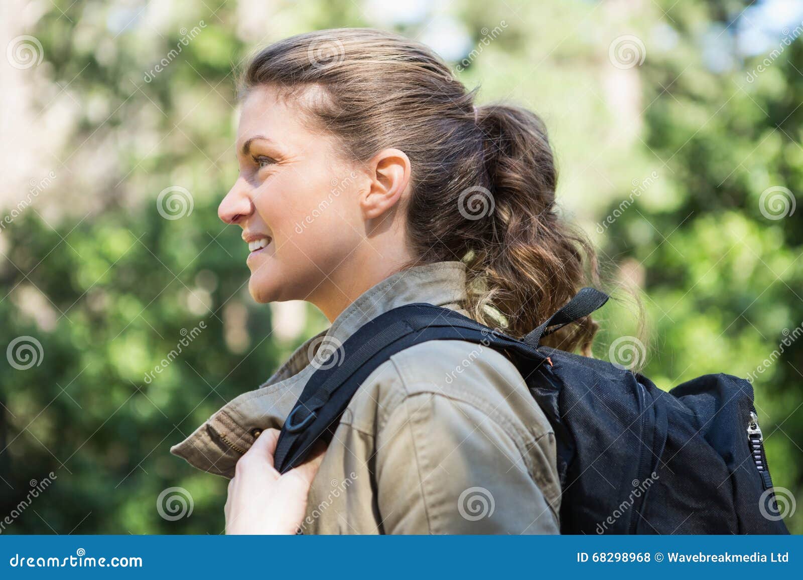 Smiling Woman with Backpack Stock Photo - Image of greenery, calm: 68298968