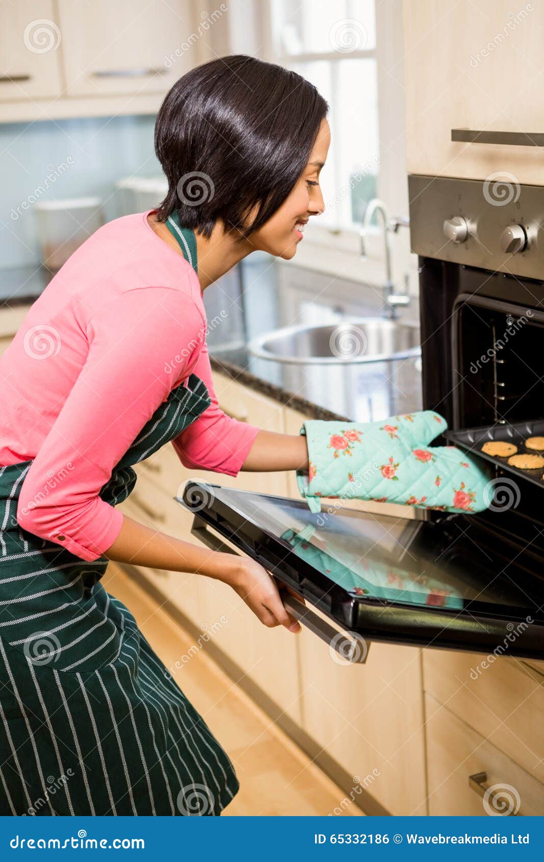 Smiling Woman Baking Biscuits Stock Photo - Image of apartment ...