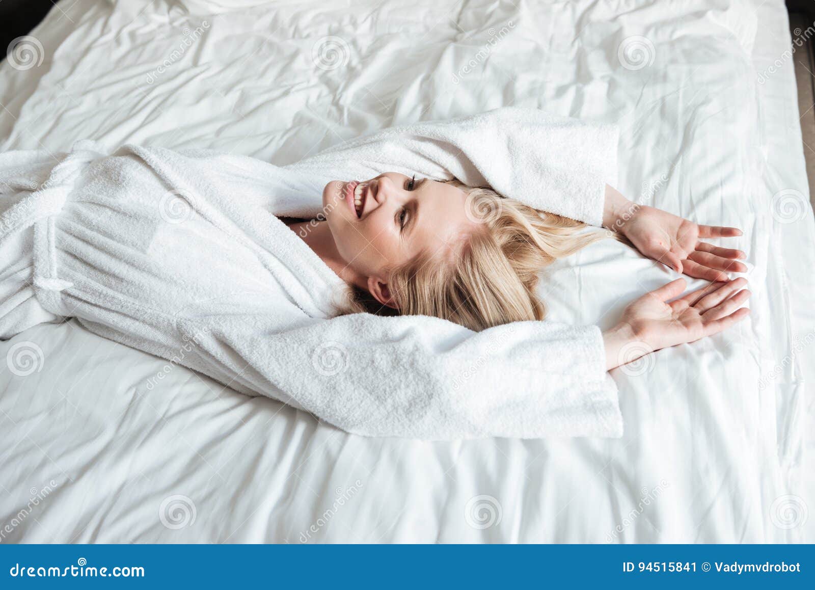 Smiling Woman in Bathrobe Resting on Bed Stock Image - Image of female ...