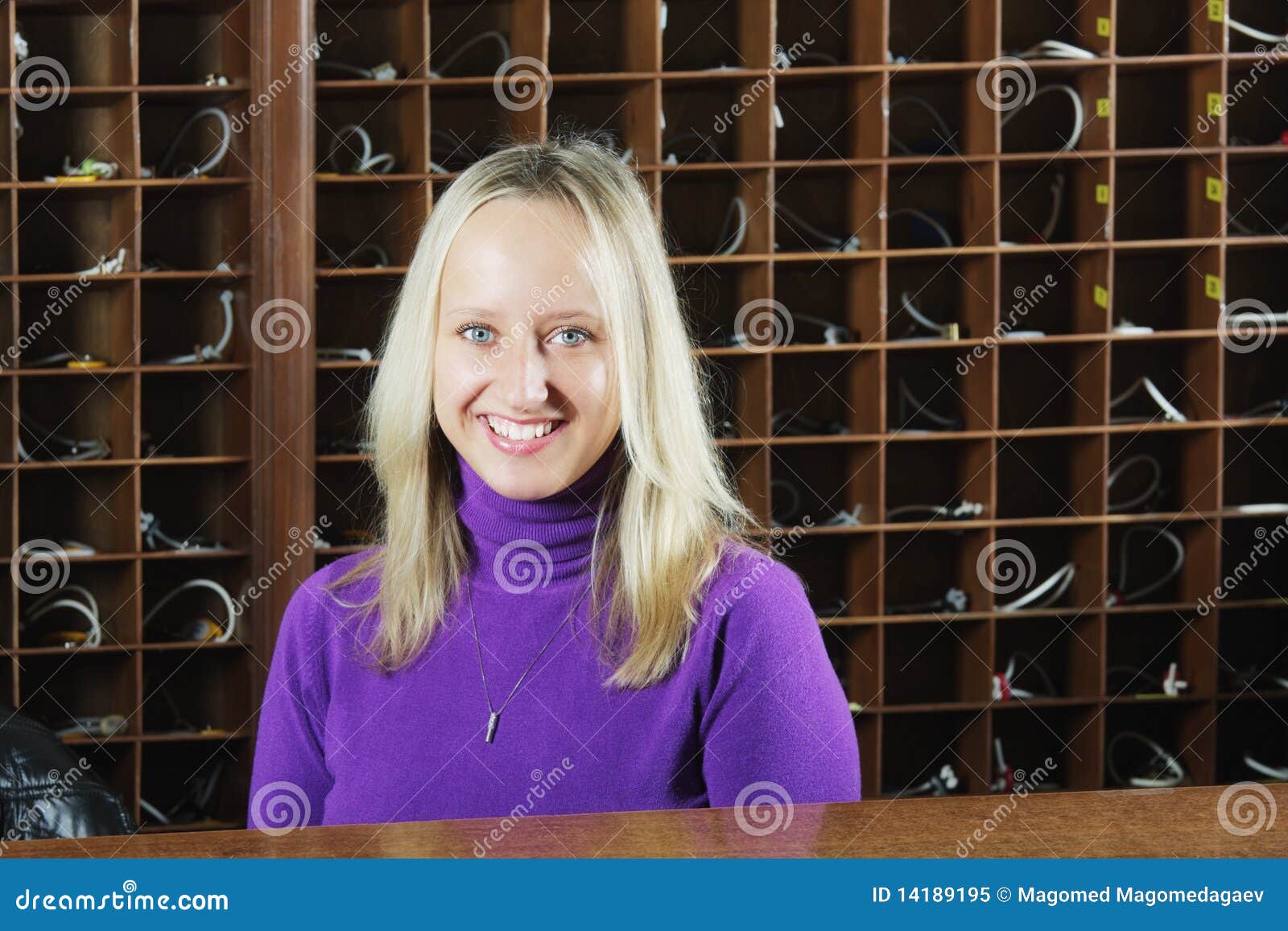 Smiling Woman Behind Counter Stock Image - Image of blonde, smiling ...