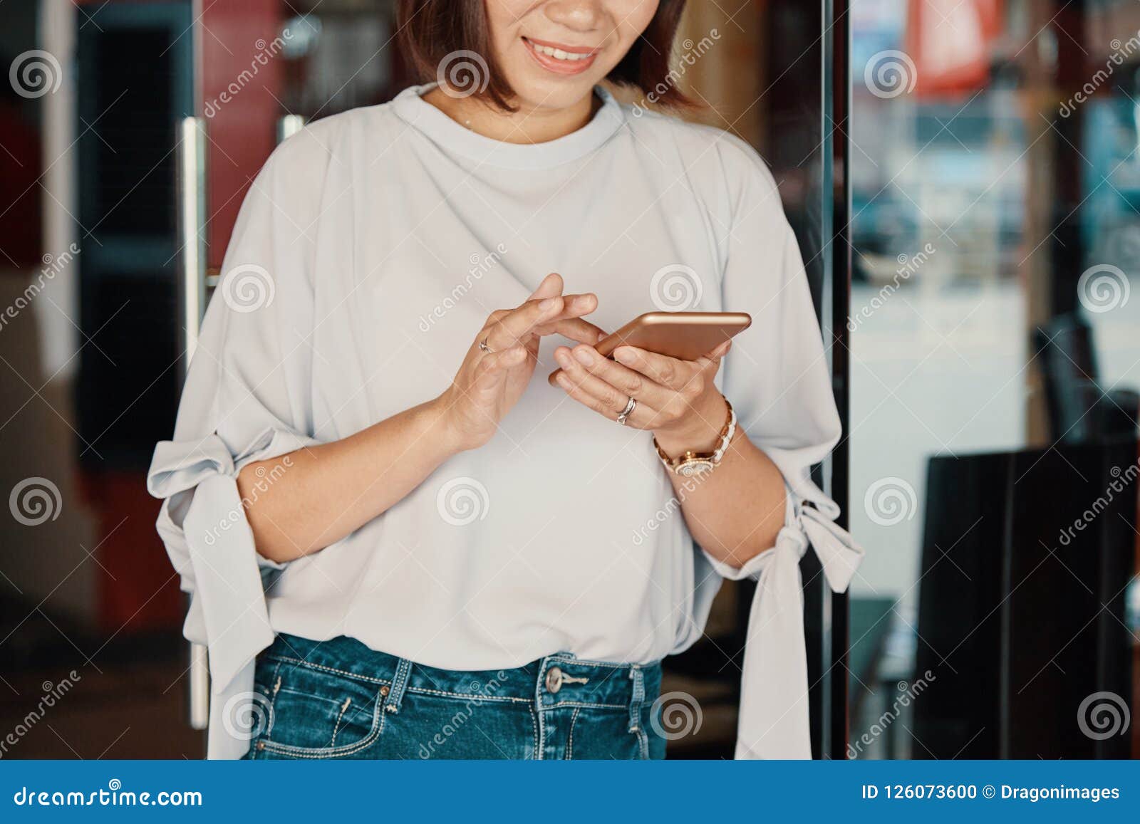 Smiling Woman Checking Smartphone Stock Photo - Image of smiling ...