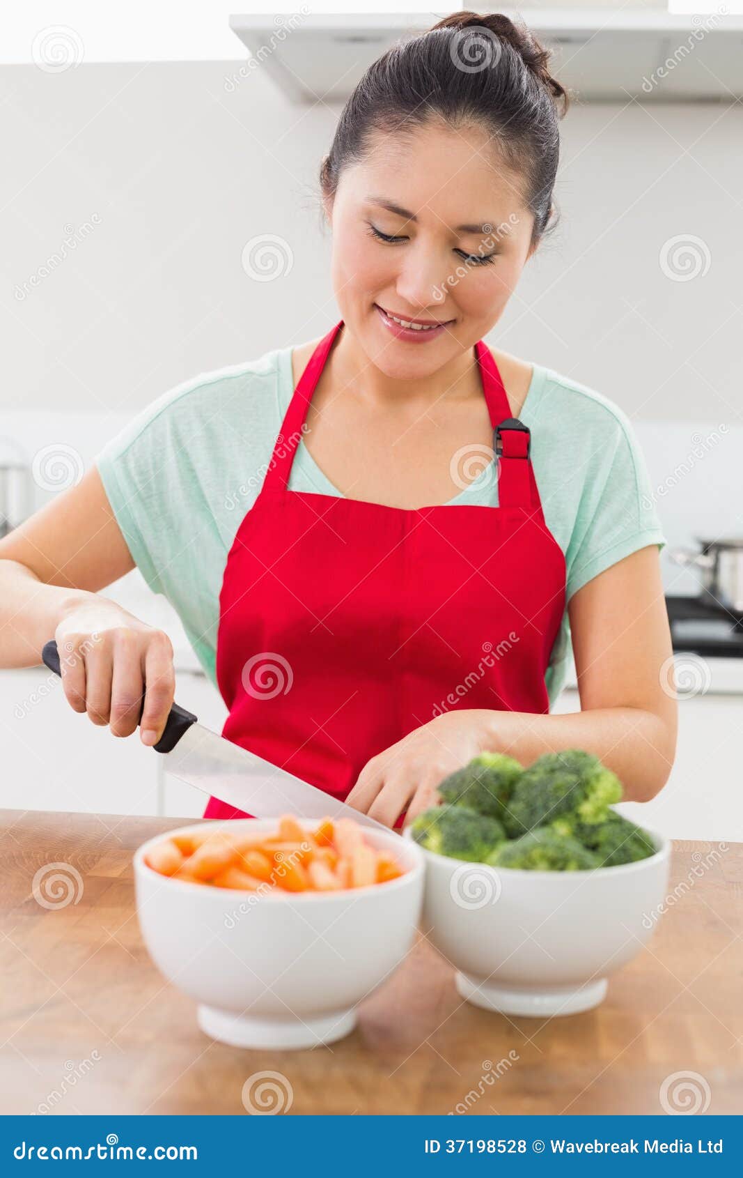 Smiling Woman Chopping Vegetables in Kitchen Stock Photo - Image of ...