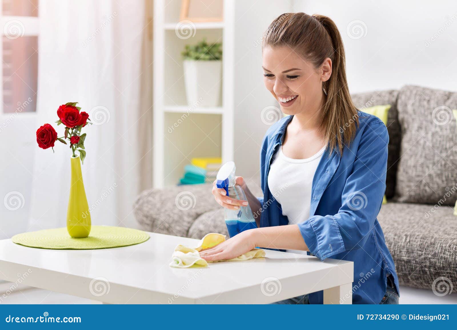 Smiling Woman Cleaning the Table Stock Photo - Image of carpet ...