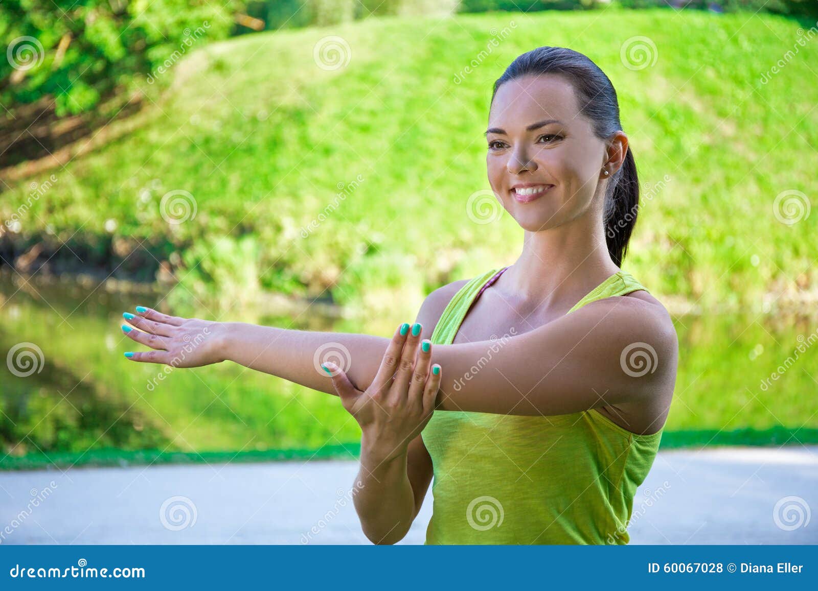 Smiling Woman Doing Stretching Exercises in Park Stock Photo - Image of ...