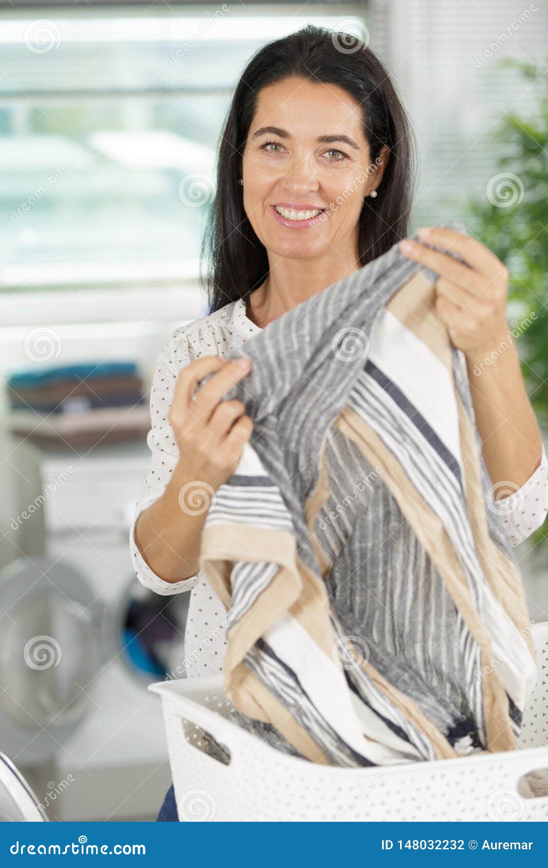Smiling Woman Doing Washing Up Stock Photo - Image of shirt, laundry ...