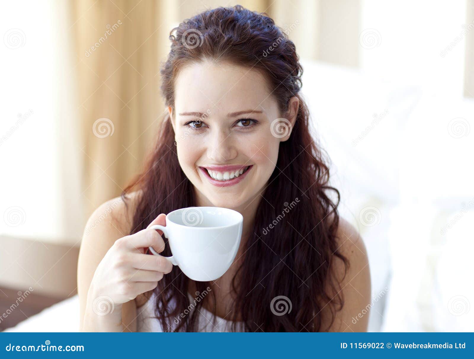 Smiling Woman Drinking a Cup of Coffee in Bedroom Stock Photo - Image ...