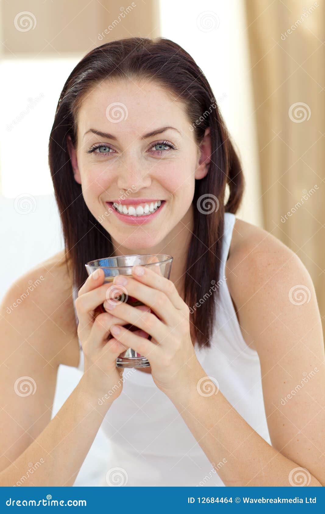 Smiling woman drinking tea stock photo. Image of adult - 12684464