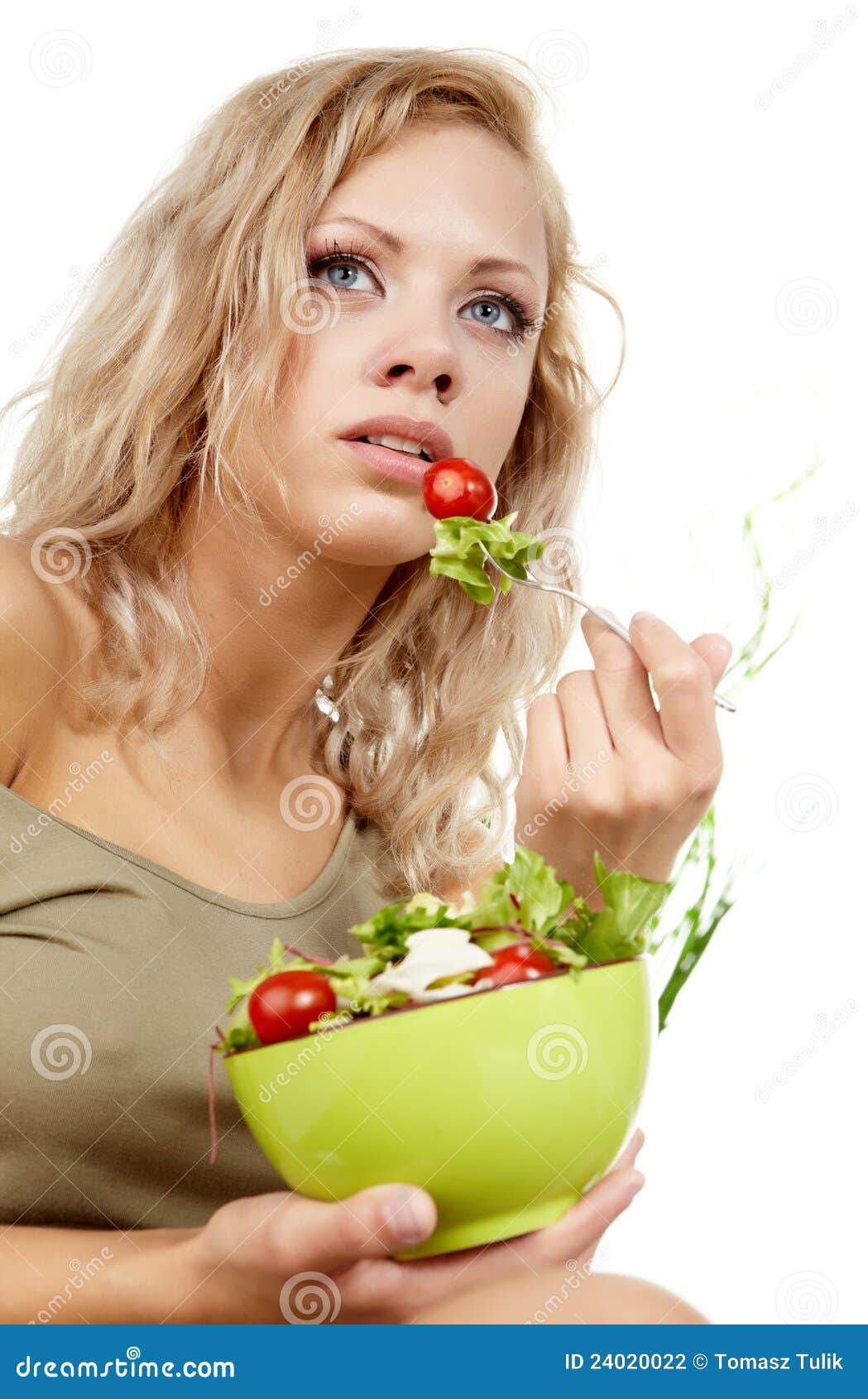 Smiling woman eating salad stock photo. Image of person - 24020022
