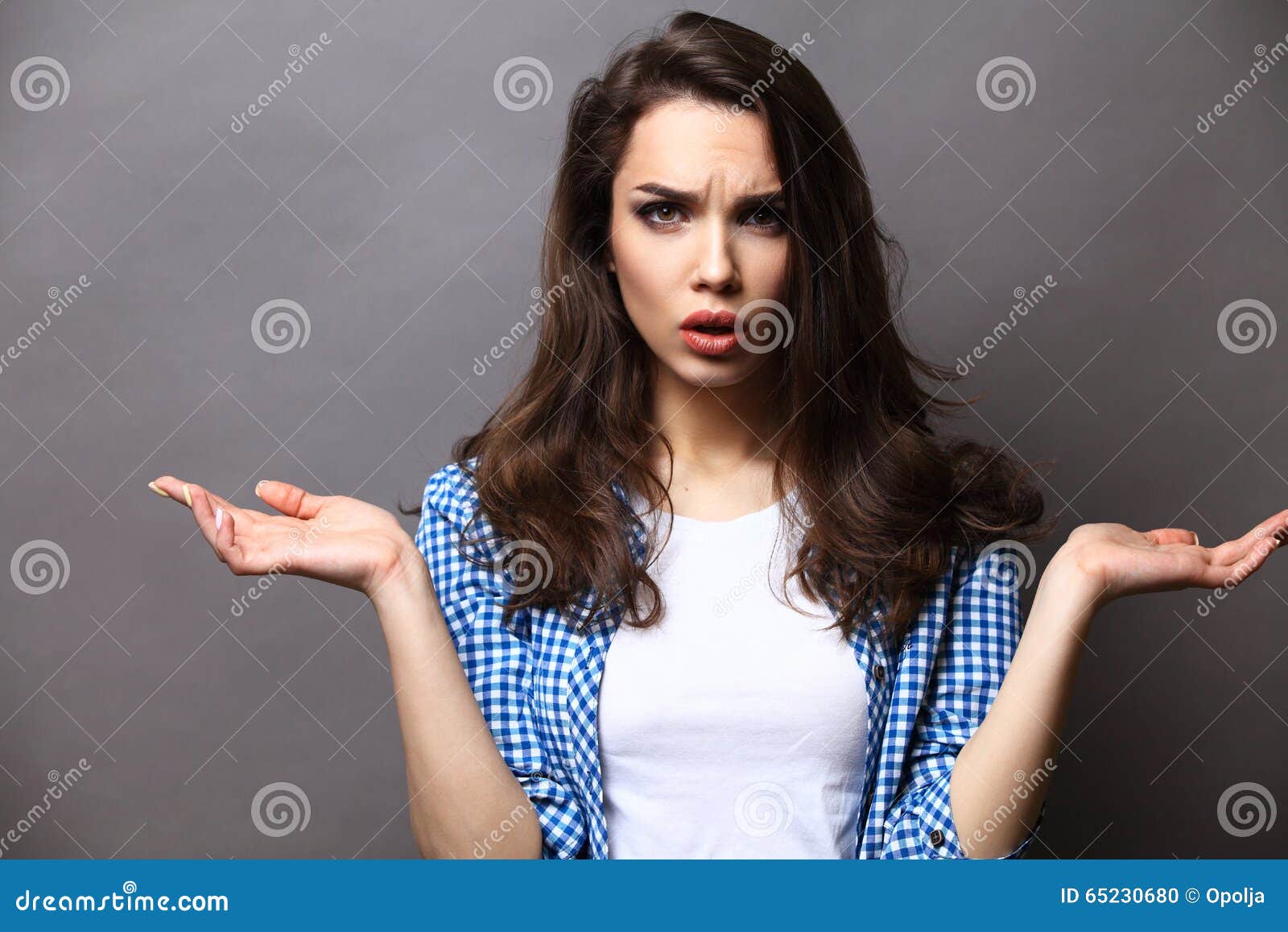 Smiling Woman in Gesture of Asking Over Gray Stock Photo - Image of ...