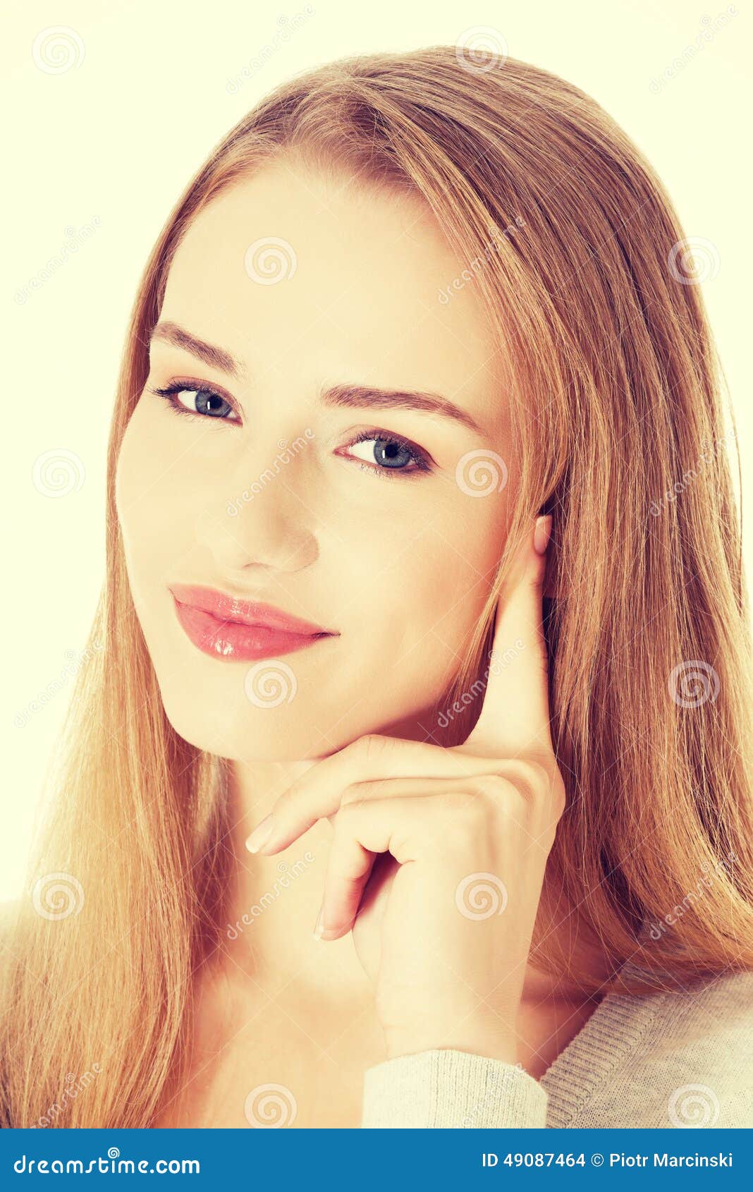 Smiling Woman with Her Finger Touching Her Face. Stock Photo - Image of ...