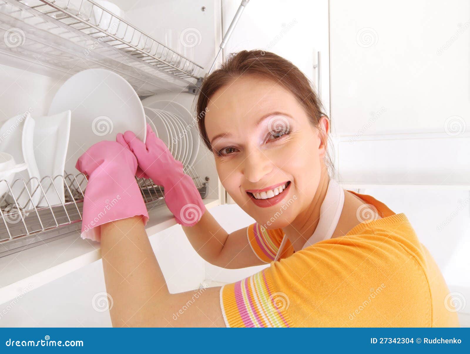 Smiling woman in kitchen stock photo. Image of gloves - 27342304