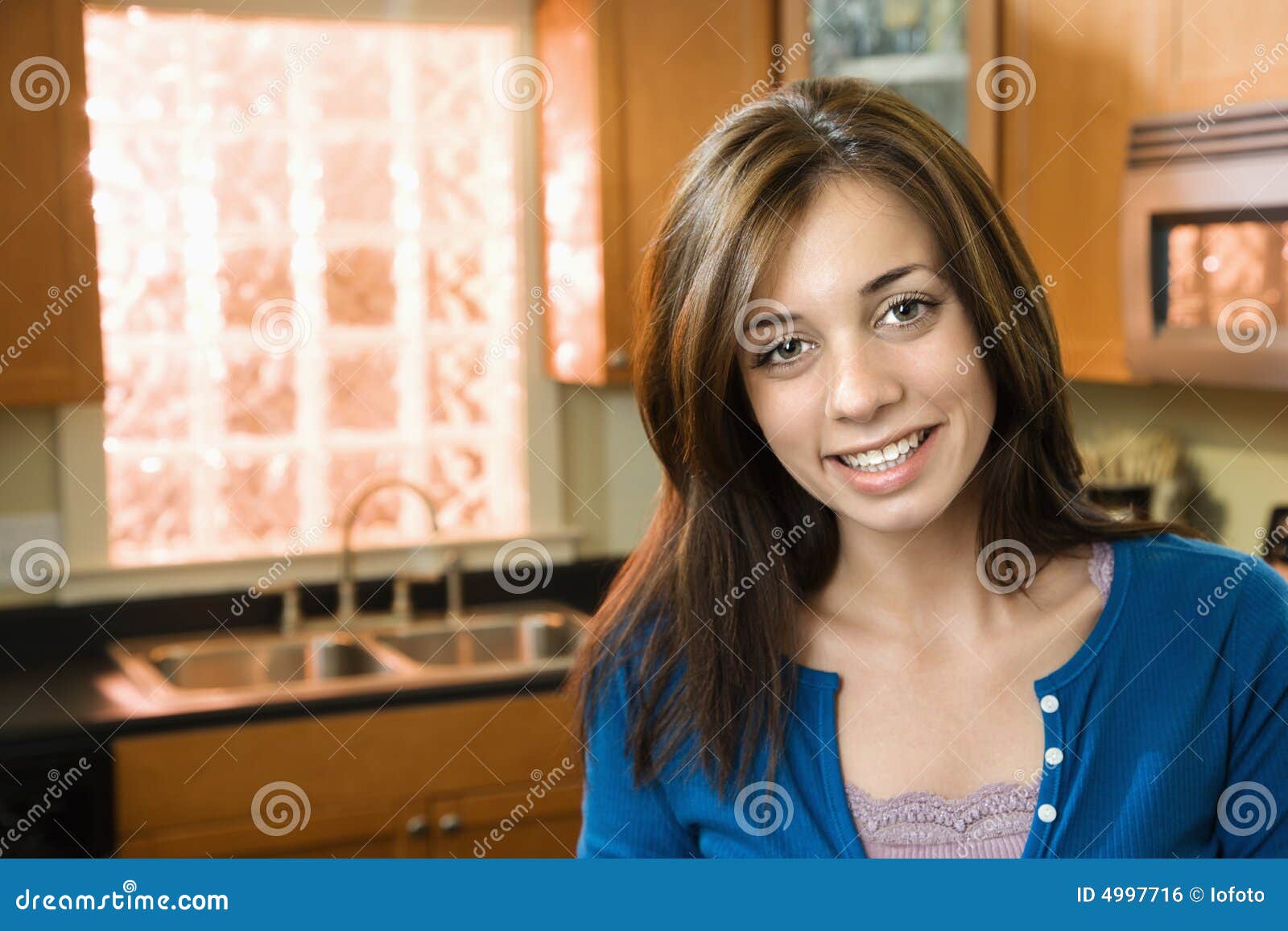 Smiling woman in kitchen stock photo. Image of pretty - 4997716