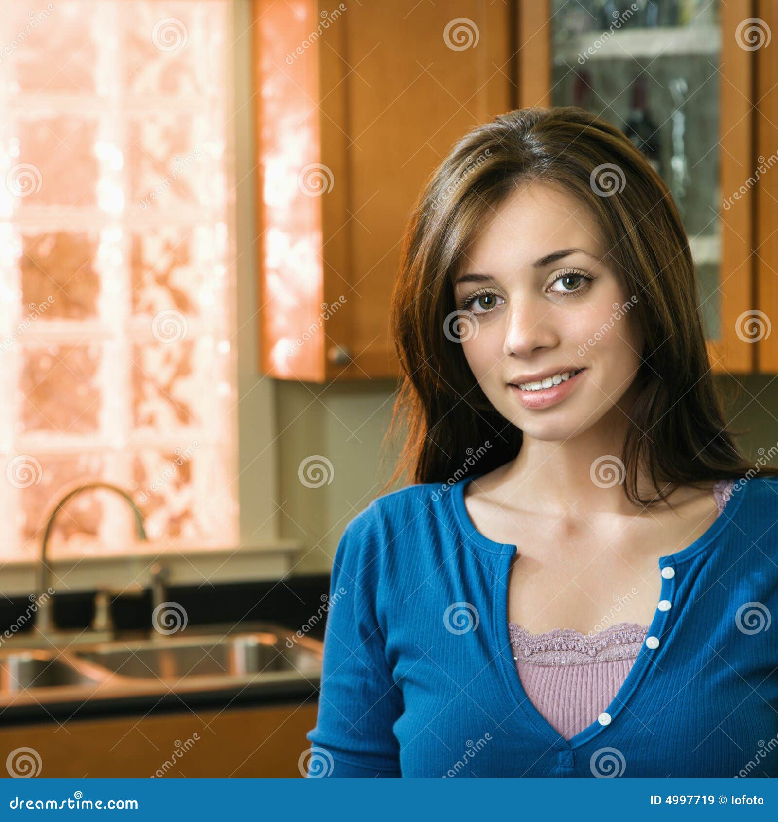 Smiling woman in kitchen stock image. Image of female - 4997719