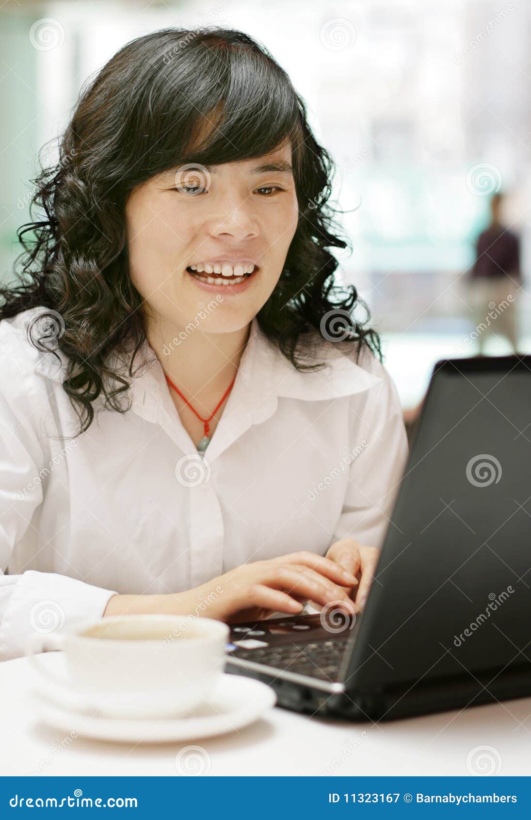 Smiling woman with laptop stock image. Image of asian - 11323167