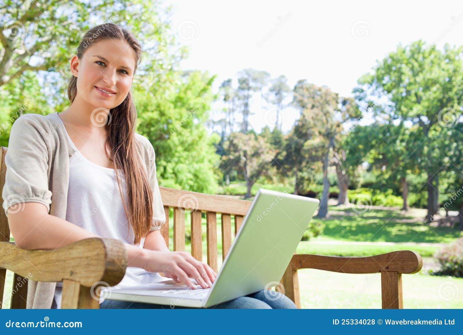Smiling Woman with a Laptop on a Park Bench Stock Photo - Image of ...