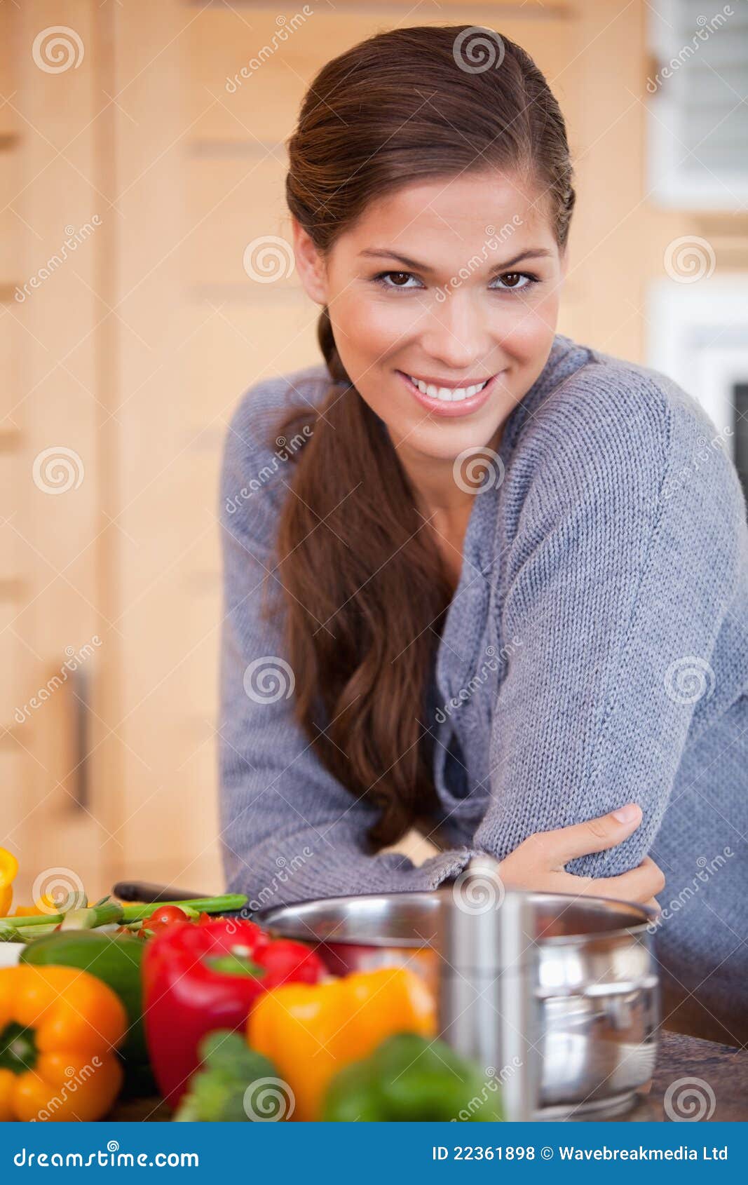 Smiling Woman Leaning Against the Kitchen Counter Stock Photo - Image ...