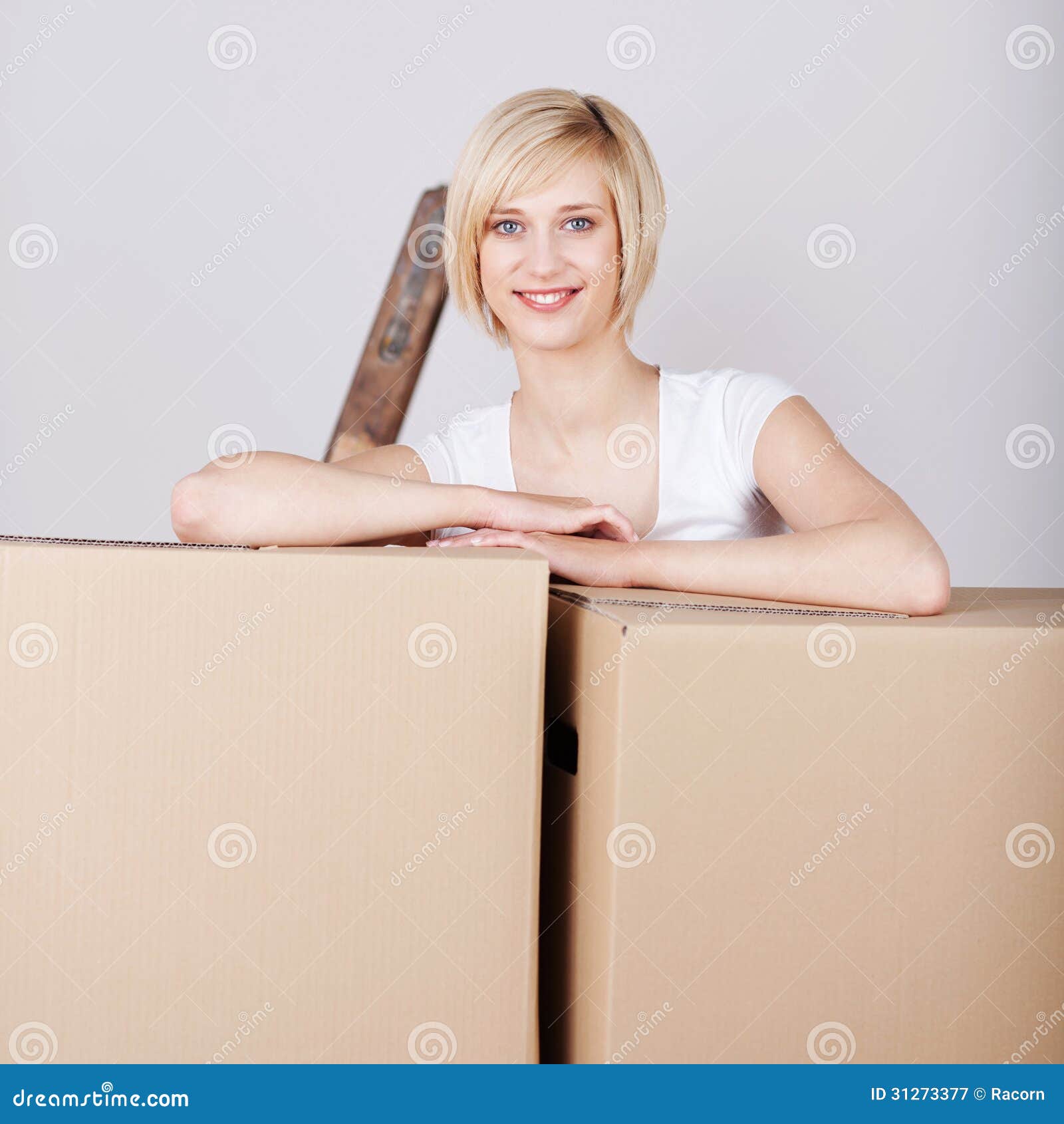 Smiling Woman Leaning on Cardboard Boxes Stock Image - Image of ...