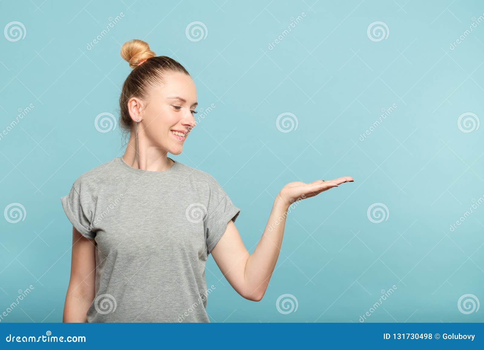 Smiling Woman Look Virtual Object Empty Hand Stock Photo - Image of ...