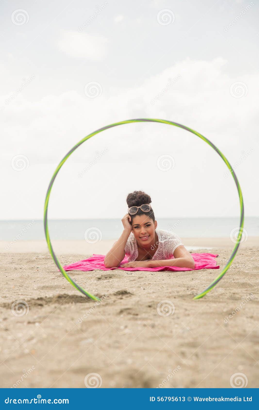 Smiling Woman Looking at Camera through Hula Hoop Stock Image - Image ...