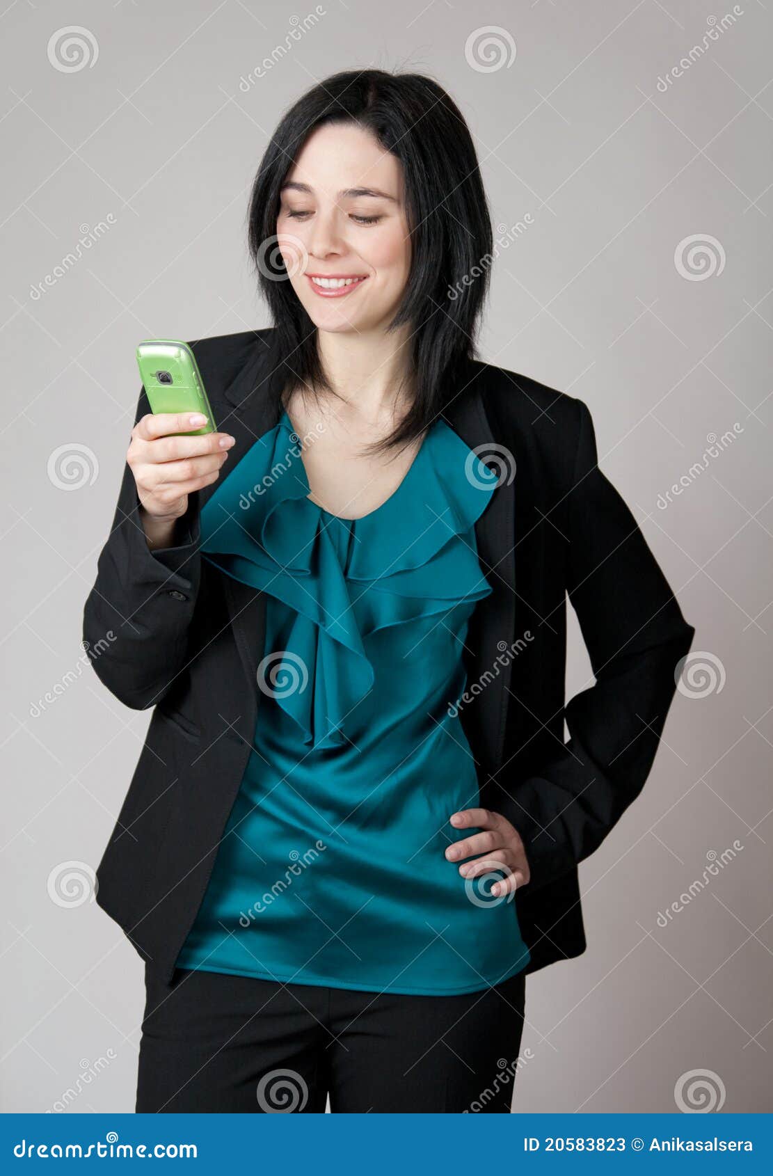 Smiling Woman Looking at Her Cell Phone Stock Image - Image of business ... Smiling Woman Looking at Her Cell Phone Stock Image - Image of business ...