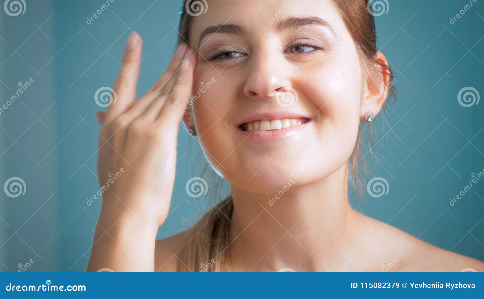 Portrait of Smiling Woman Looking in Her Reflection at Mirror and ...