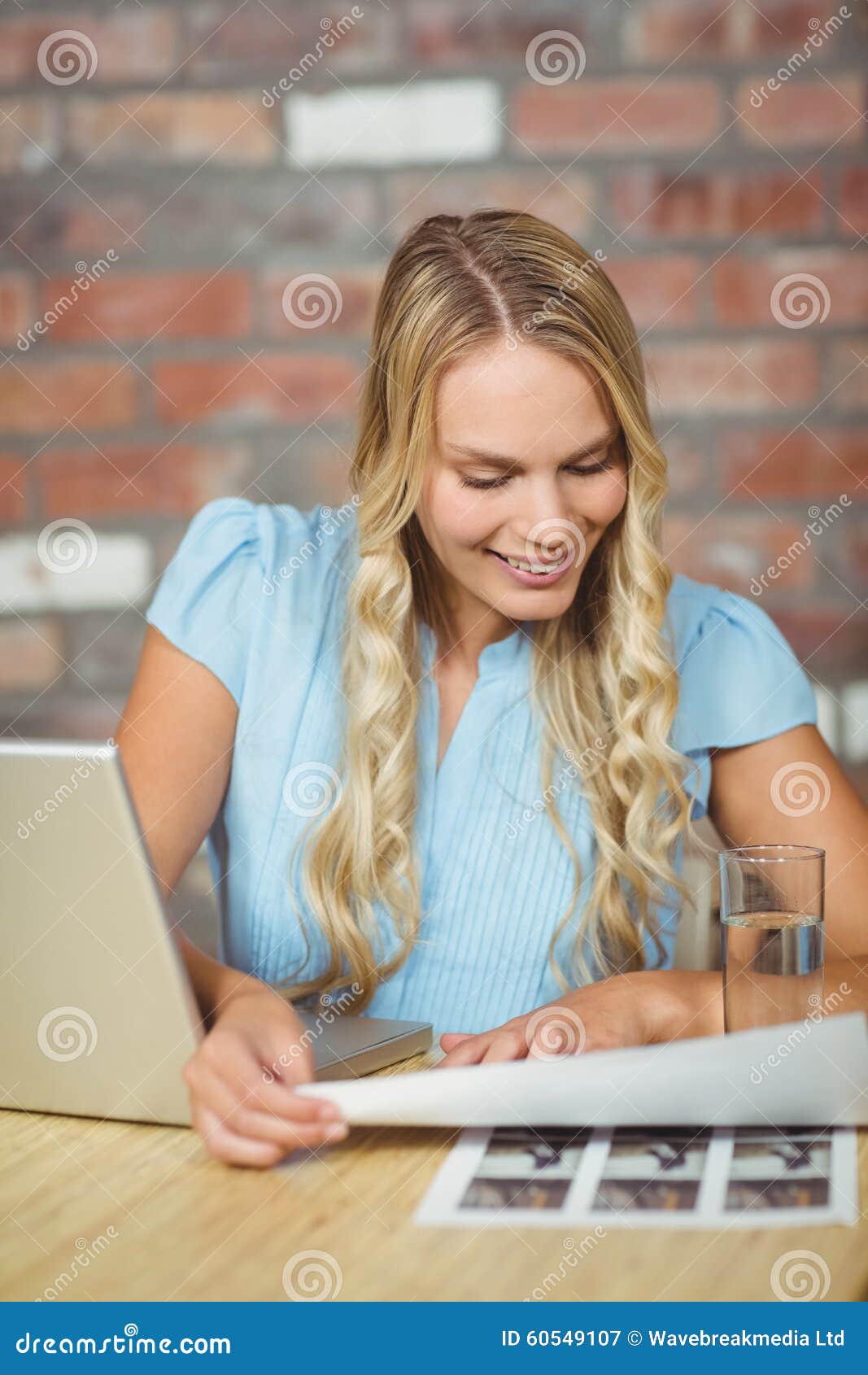 Smiling Woman Looking at Photos Stock Image - Image of laptop, length ...