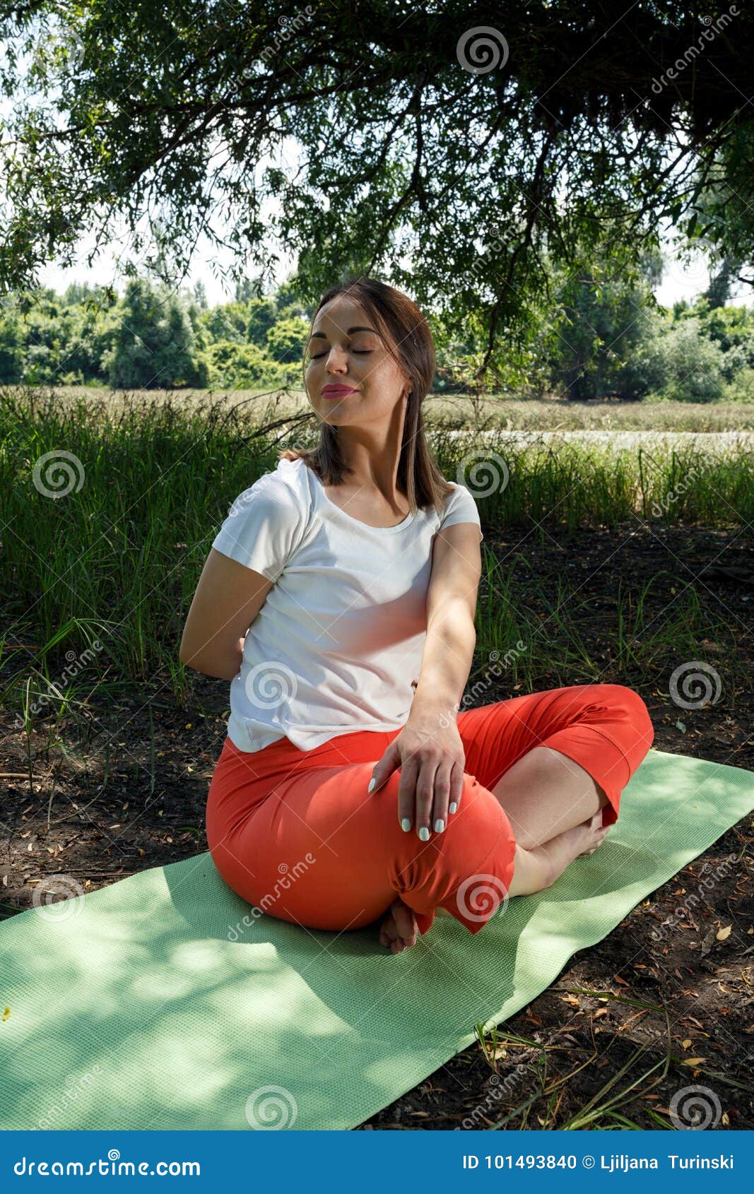 Smiling woman in yoga pose stock photo. Image of energy - 101493840