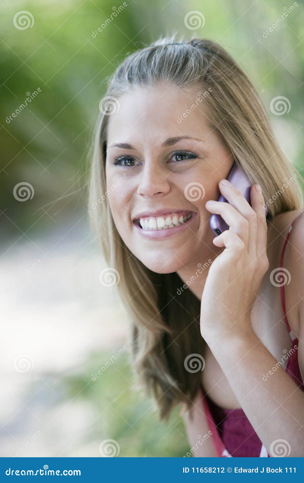 Smiling Woman Outdoors with Cell Phone Stock Photo - Image of holding ...