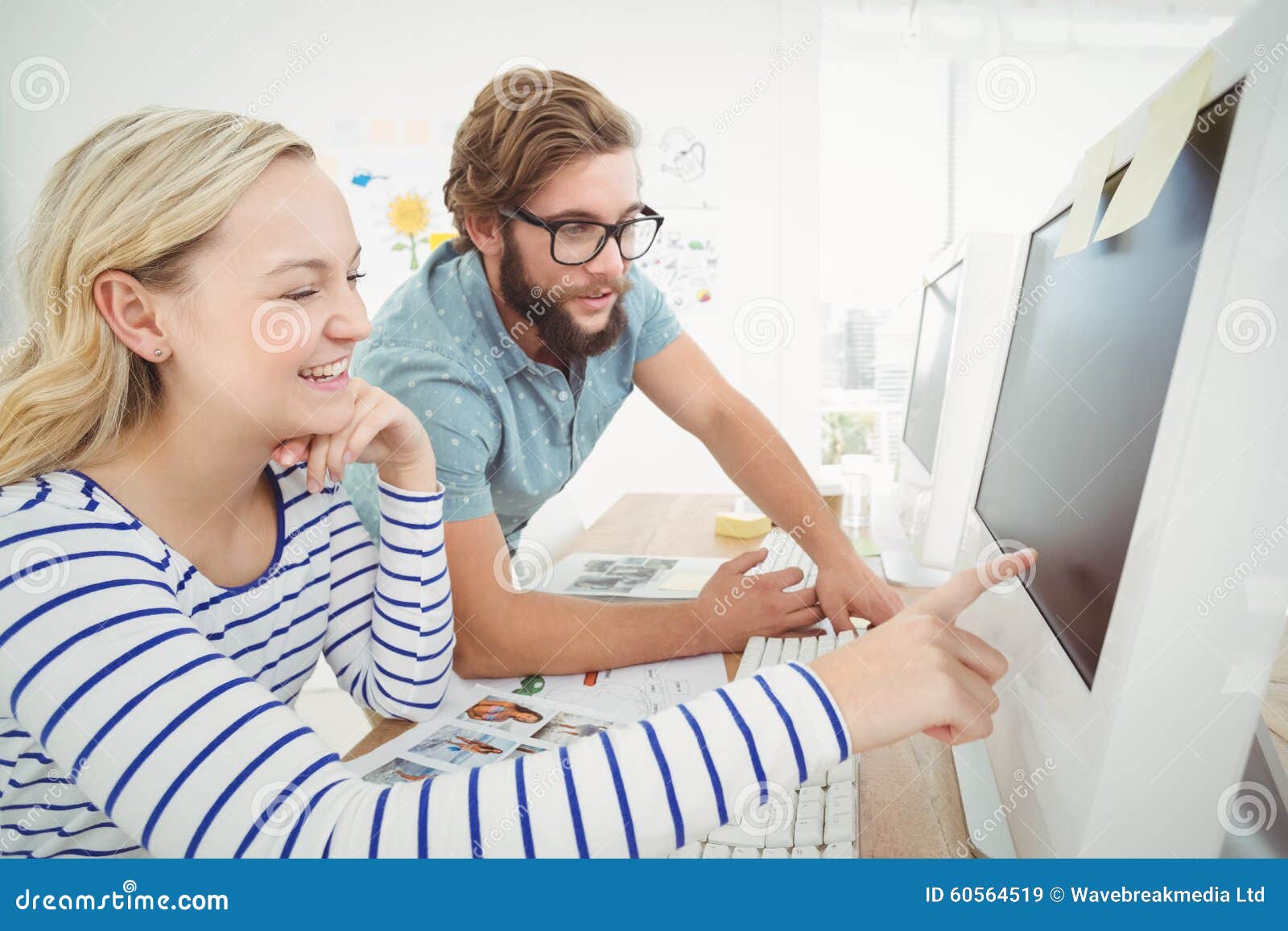 Smiling Woman Pointing at Computer Stock Image - Image of foreground ...