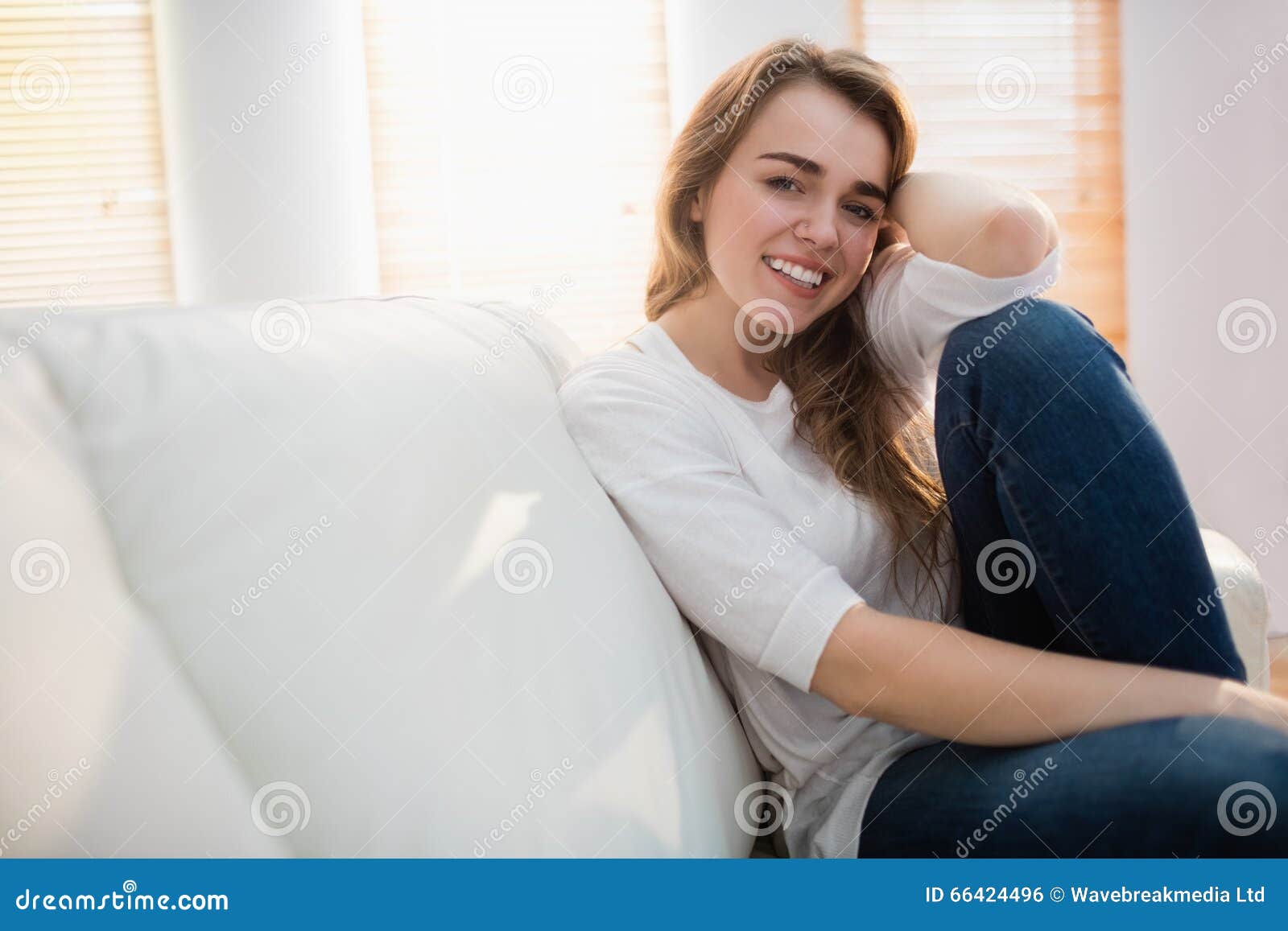 Smiling Woman Posing on the Couch Stock Photo - Image of adult, indoors ...