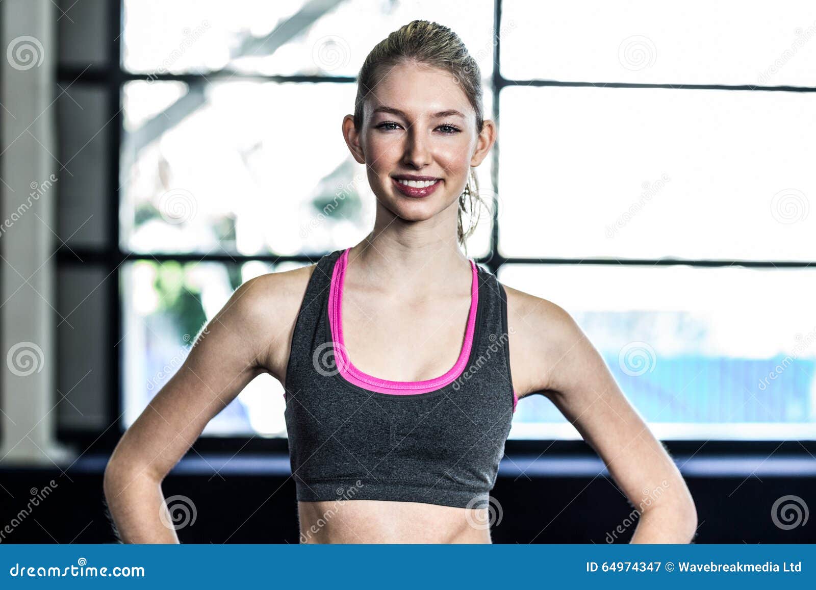 Smiling Woman Posing with Hands on Hips Stock Image - Image of female ...