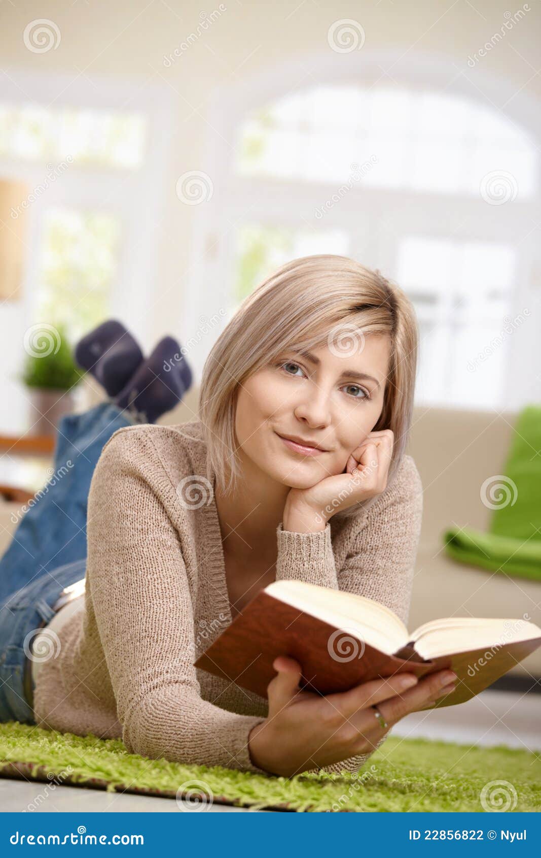 Smiling woman reading book stock photo. Image of enjoymant - 22856822