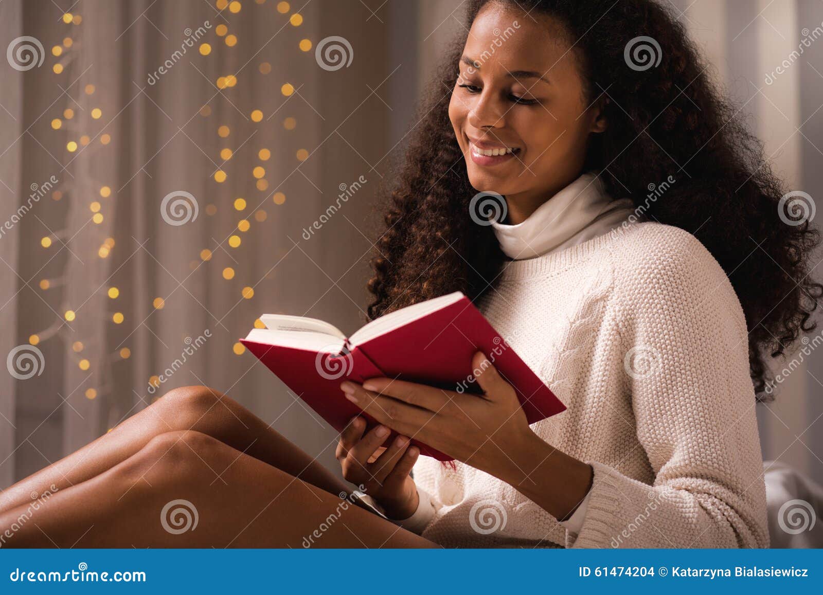Smiling Woman Reading Novel Stock Photo - Image of literature, woolen ...